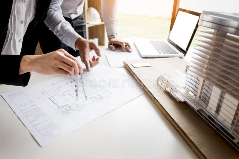 Person& X27;s Engineer Hand Drawing Plan on Blue Print with Architec ...