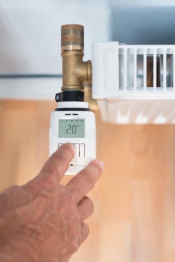 Person S Hand Adjusting Temperature on Thermostat Stock Image - Image ...