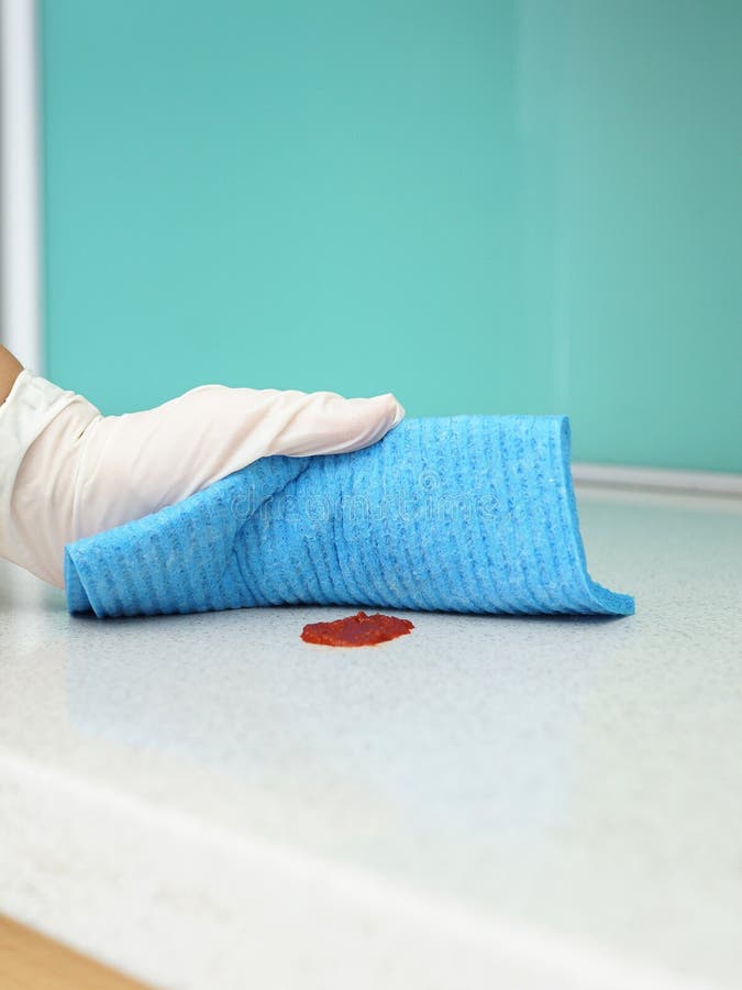 Person S Hand Cleaning Ketchup on Kitchen Counter Stock Photo - Image ...