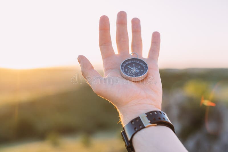 Person S Hand Holding Compass. High Quality Photo Stock Image - Image ...