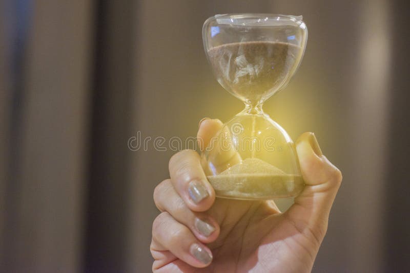 Person& X27;s Hand Holding an Hourglass Still Life Stock Photo - Image ...