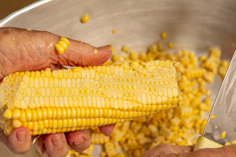 A Person S Hands Cutting Corn. Stock Image - Image of dish, goias ...