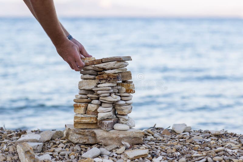 Person S Hands Stacking Stones Cairn Balanced Structure Stock Photo ...