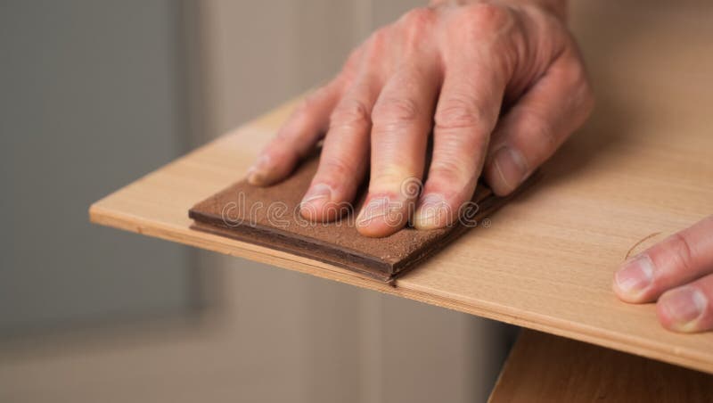 Person is Sanding a Piece of Wood with a Piece of Sandpaper Stock Image ...