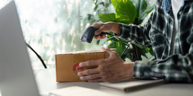 Person Scanning Barcode on Cardboard Box with Handheld Scanner ...