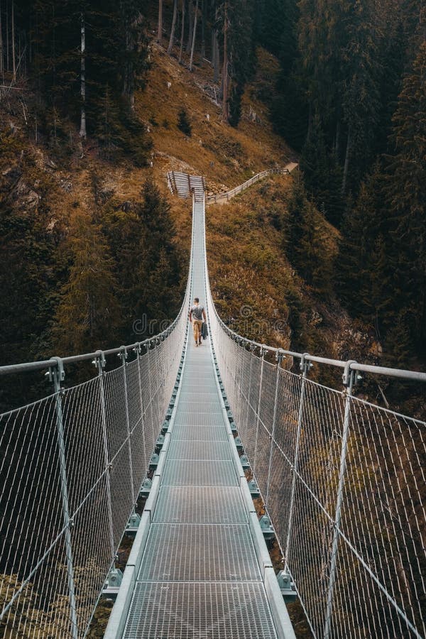 Person on a Self-anchored Suspension Bridge Stock Photo - Image of ...