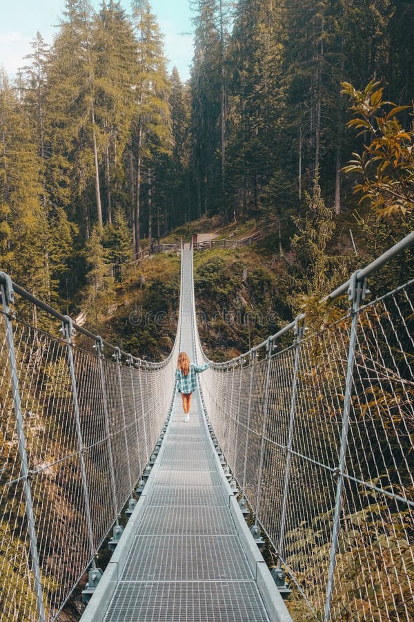 Person on a Self-anchored Suspension Bridge Stock Image - Image of ...