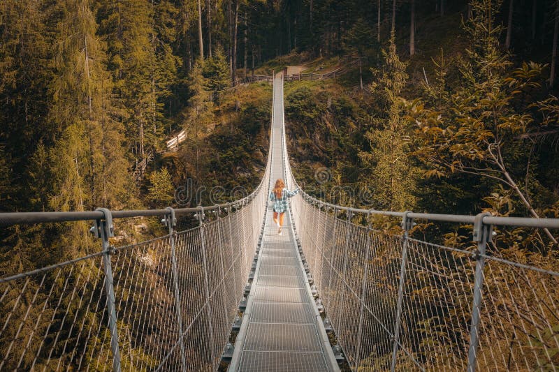 Person on a Self-anchored Suspension Bridge Stock Photo - Image of tree ...