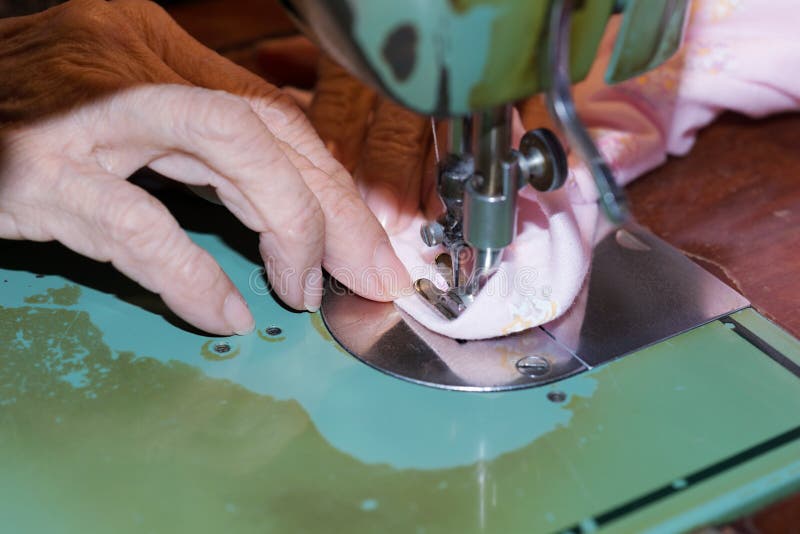 Person sewing machine stock image. Image of factory, cloth - 48580055