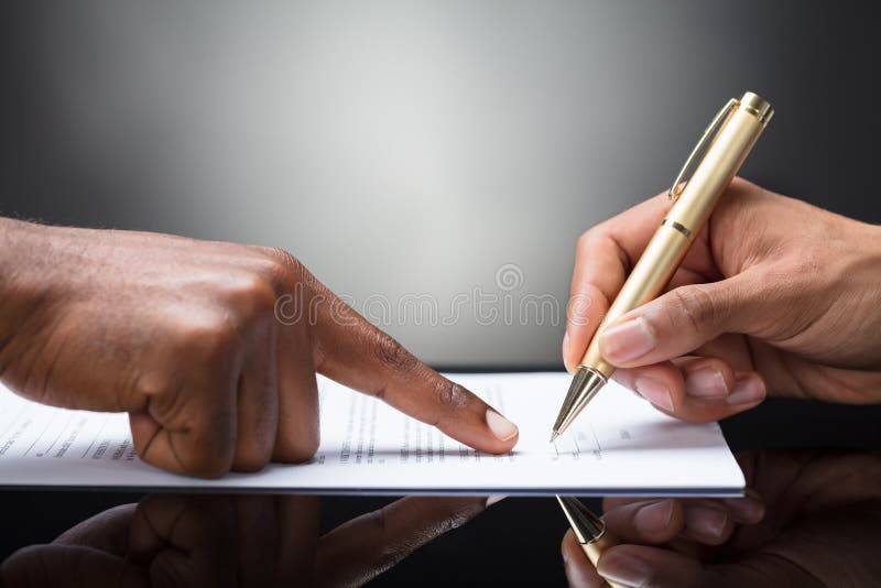 African American Businessman Signing Document Stock Image - Image of ...