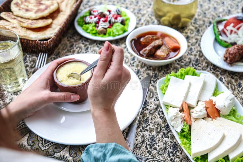 Person Sitting at Table with Plate of Food Stock Image - Image of ...