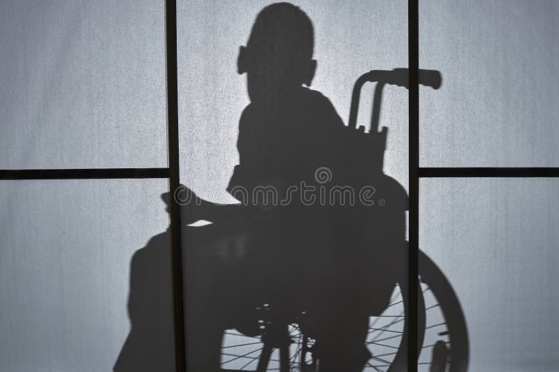 Person Sitting in Wheelchair Behind a Translucent Screen Stock Photo ...