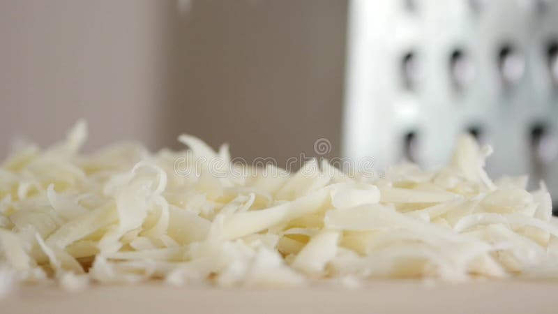 Shredding Cheese with Precision in a Cozy Kitchen Stock Footage - Video ...