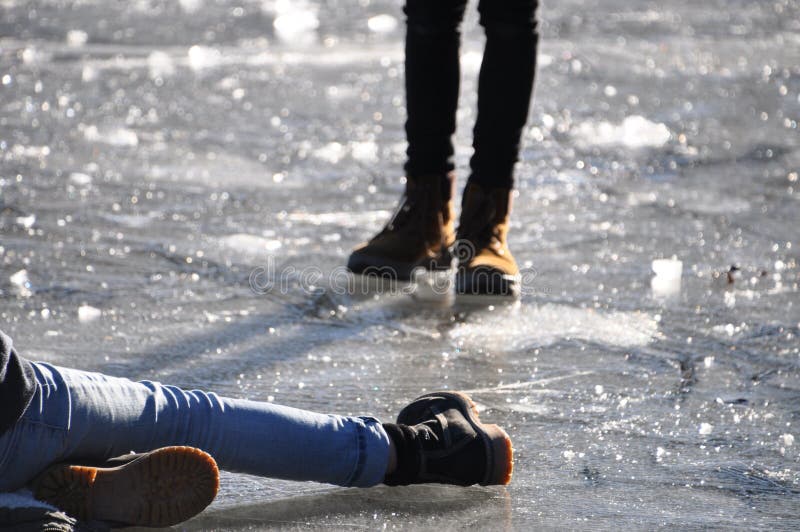 Person Slipped on Frozen Lake Stock Image - Image of boots, surface ...