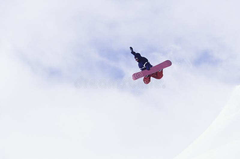 Person on Snowboard Jumping Midair Stock Photo - Image of action ...