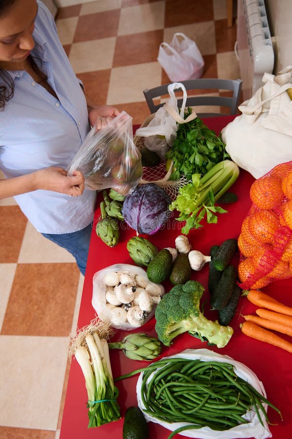 Person Sorting Fresh Vegetables in Kitchen with Diverse Greens Stock ...