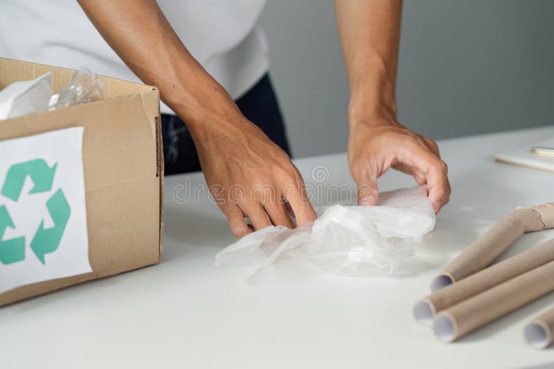 Person Sorting Plastic Waste and Recycling Materials in an Organized ...
