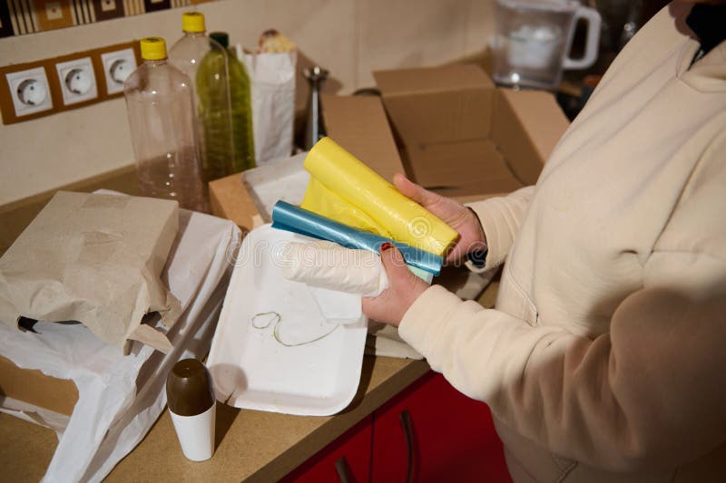 Person Sorting Recycling Materials in a Home Kitchen Environment Stock ...