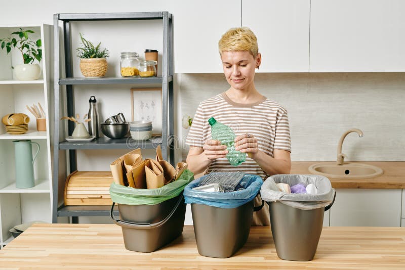 A Person Sorting Waste in a Kitchen Stock Photo - Image of males ...
