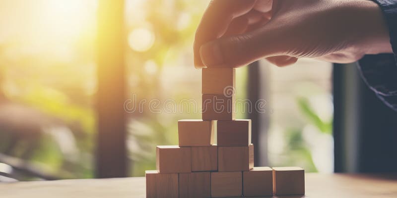 A Person is Stacking Wooden Blocks on Top of Each Other Stock ...