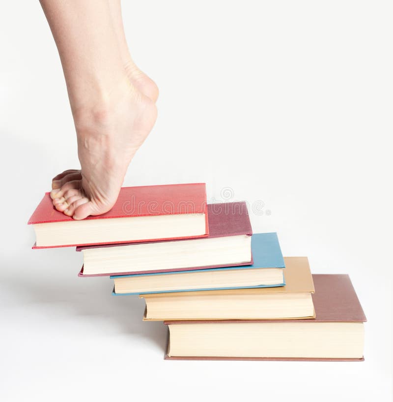 Person standing on books stock photo. Image of primary - 28330694