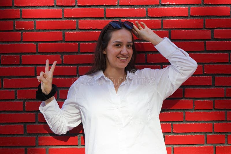 A Person Standing in Front of a Brick Wall Stock Image - Image of ...