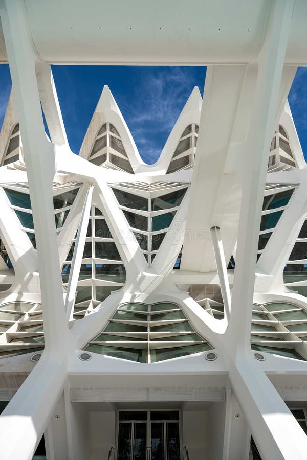 A Person Standing in Front of an Interesting Building with a Blue Sky ...