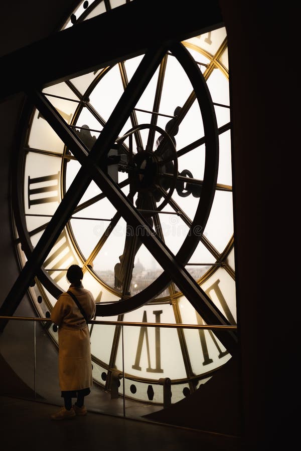 Person Standing in Front of a Large Clock at Night Editorial ...