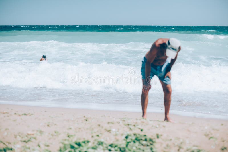 Person Standing at the Ocean Shore in Front of the Crashing Waves ...
