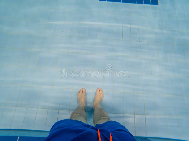 Person Standing in Pool with Blue Swim Trunks Stock Image - Image of ...