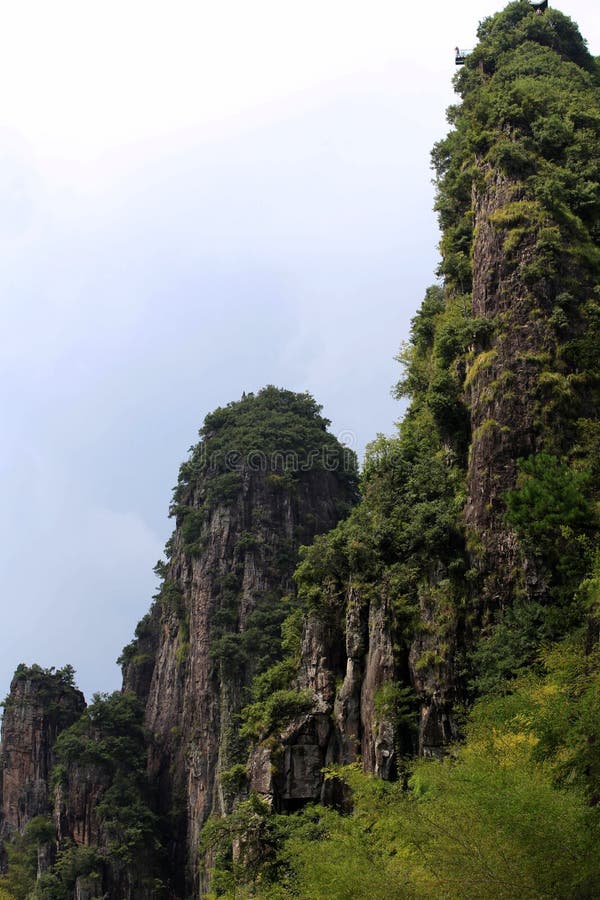 A Person Standing at the Top of the Mountain Stock Photo - Image of ...
