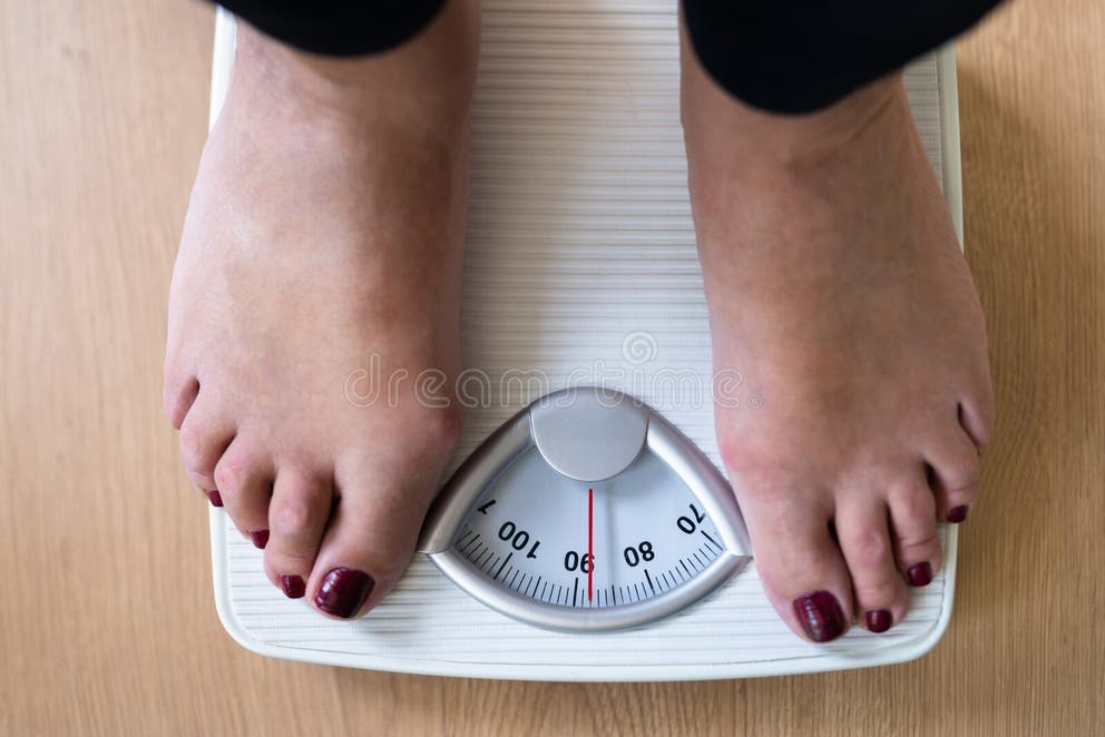 Person Standing on Weighing Scale Stock Photo - Image of jean, accuracy ...
