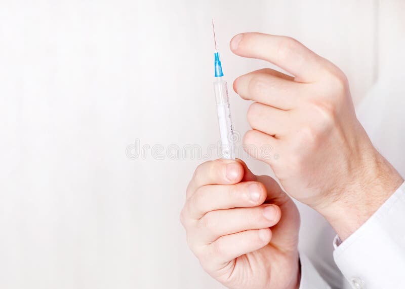 Person with a Syringe stock image. Image of syringe - 235776637
