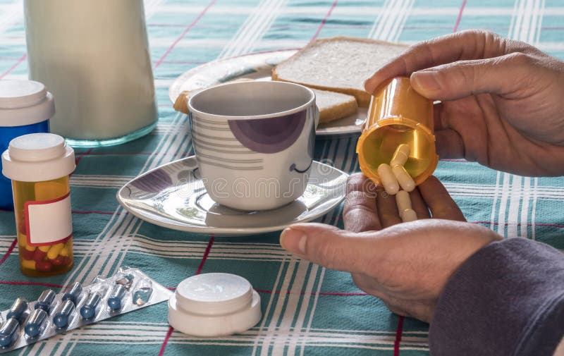 Person Takes Medication during Breakfast Stock Image - Image of ...