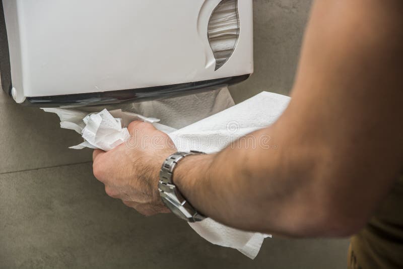 Person taking paper towels stock photo. Image of muscular - 121491896