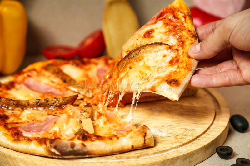 Person Taking a Slice of Pizza Stock Photo - Image of american, dinner ...
