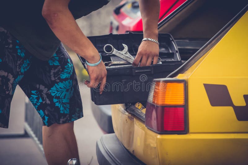 A Person Taking Tools Out the Box in Trunk Stock Photo - Image of ...