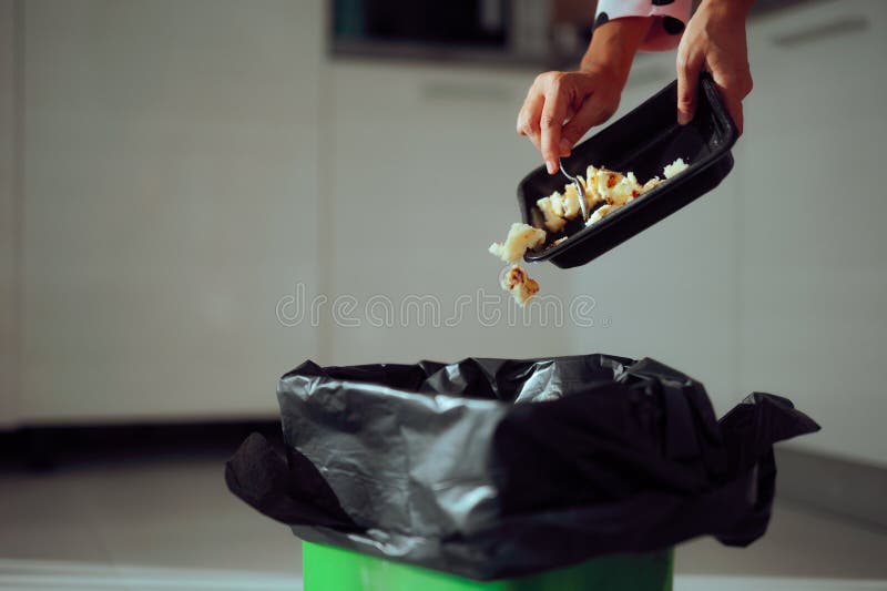 Person Throwing Leftover Food in the Trash at Home Stock Image - Image ...