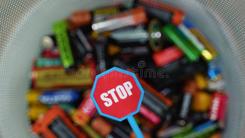 A Person Throws Batteries into a Bin. Stop Pollution by Batteries ...
