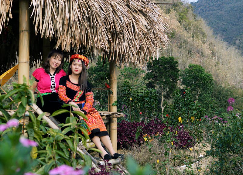 Person In Traditional Dress Sitting On Hut Picture. Image: 112878247