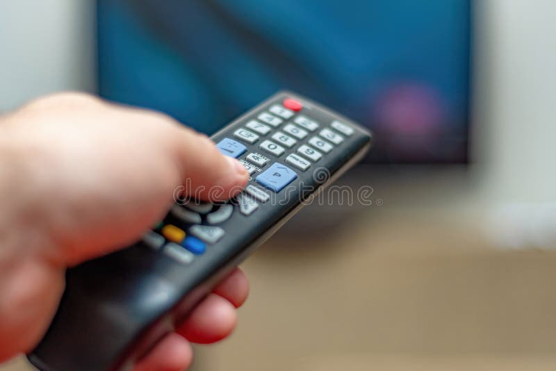 A Person with a TV Remote Controls the Remote Control To Switch ...