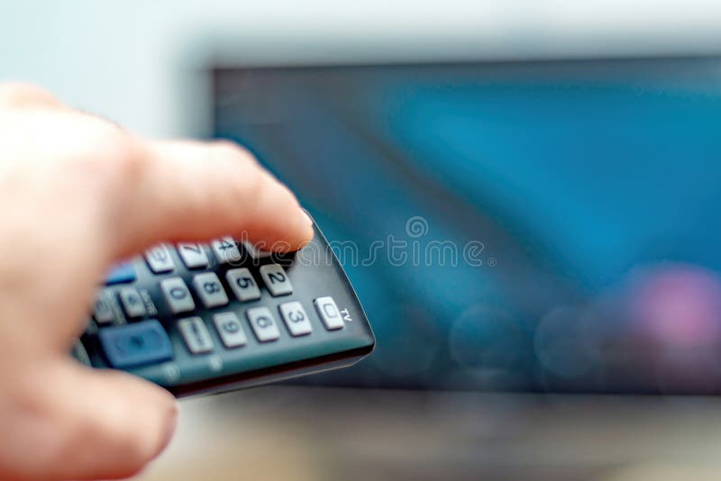 A Person with a TV Remote Controls the Remote Control To Switch ...