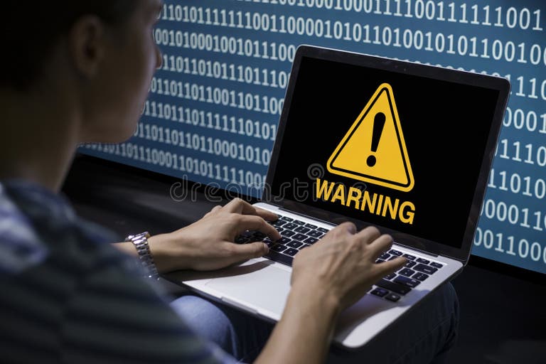 Cybersecurity Warning on Laptop Screen with Binary Code for Data Breach ...