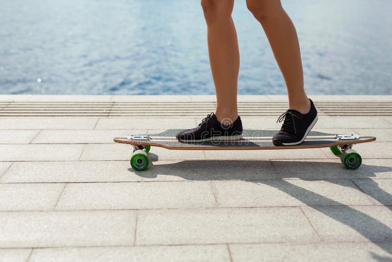 Person in Urban Environment Riding Longboard Stock Image - Image of ...