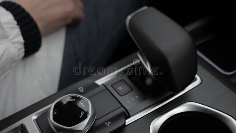 A Person Uses a Cars Dashboard and Steering Wheel, Showing Features ...