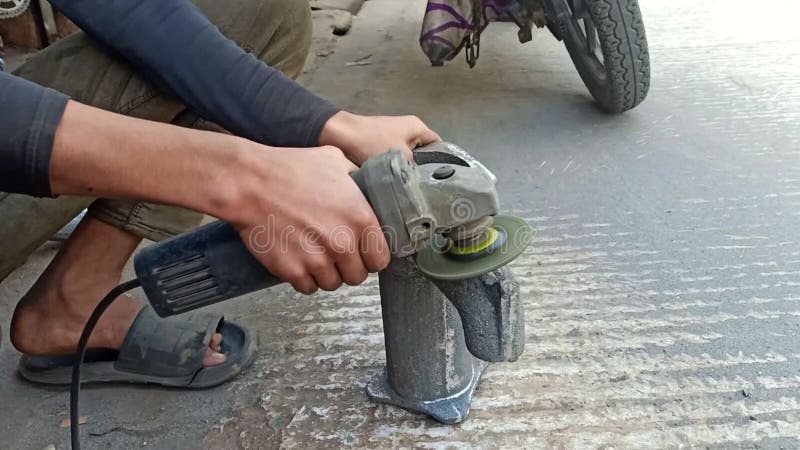 Person Using an Angle Grinder for Metalwork Outdoors Stock Video ...