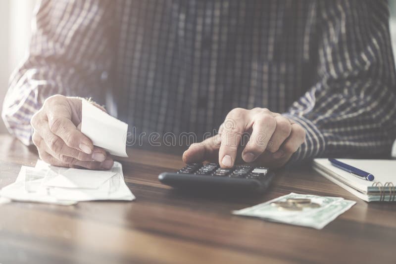 Person Using Calculator and Counting Bills Stock Photo - Image of ...