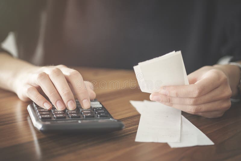 Person Using Calculator and Counting Bills Stock Image - Image of ...