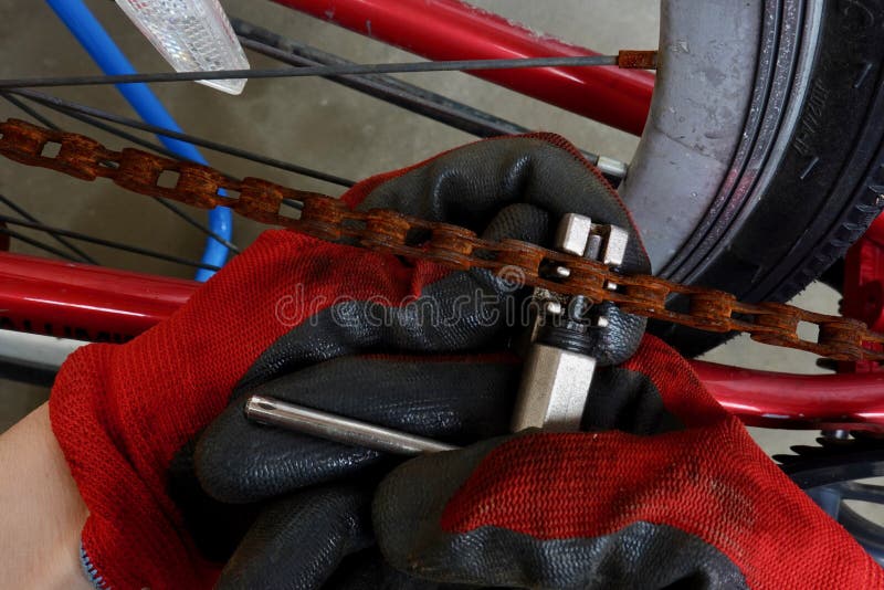 Person Using Chainbreaker Tool To Remove Bicycle Chain. Stock Image ...