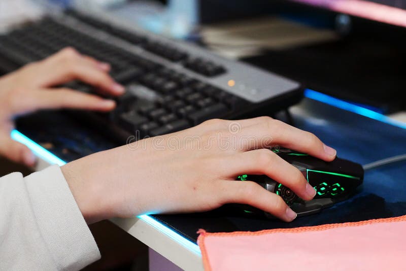 A Person Using a Computer Mouse, a Person Playing a Game on a Desktop ...